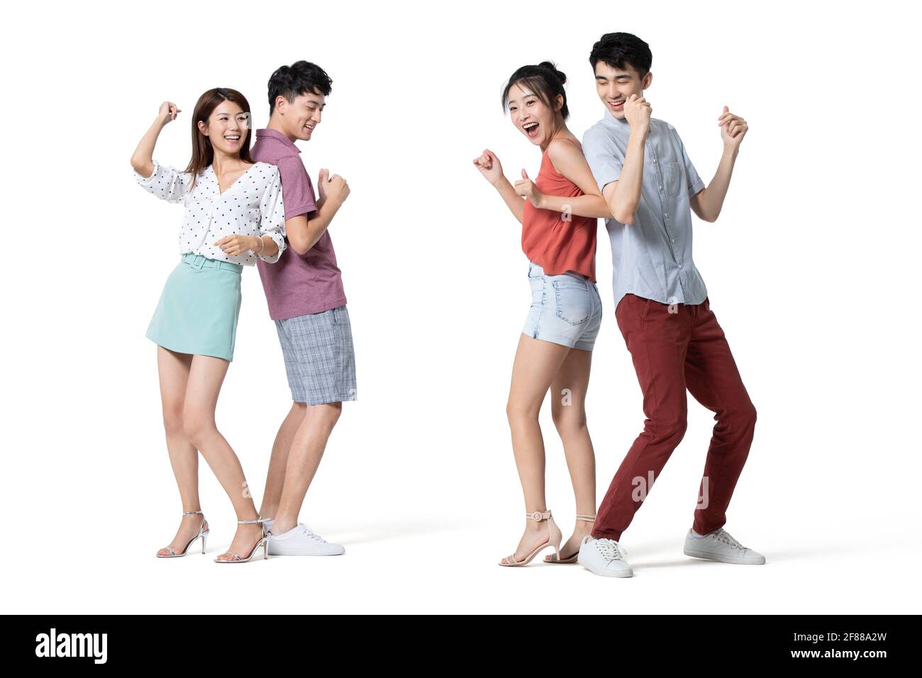 Cheerful young friends dancing together Stock Photo - Alamy