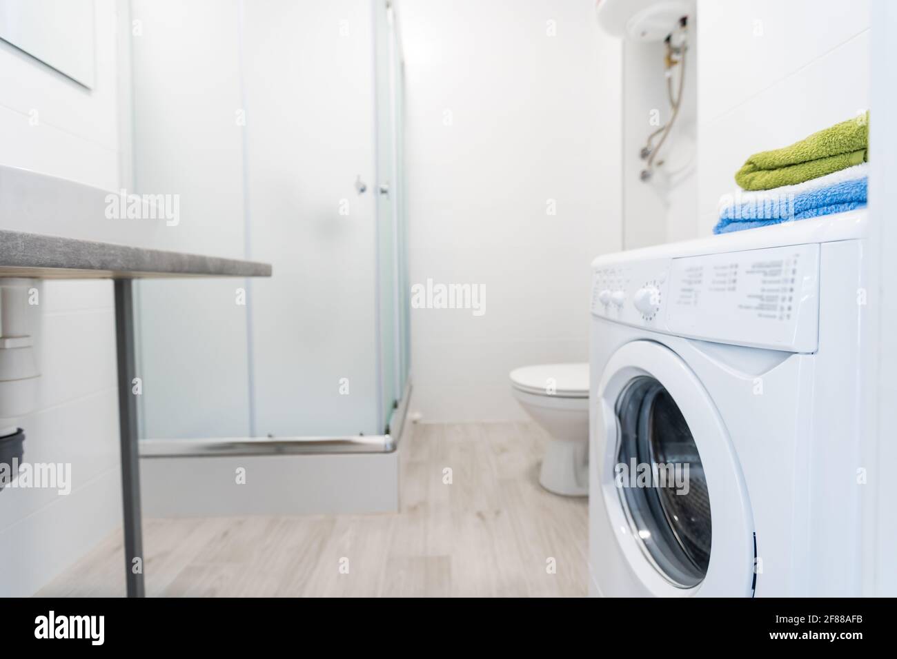 Modern white washing machine front panel with display Stock Photo - Alamy