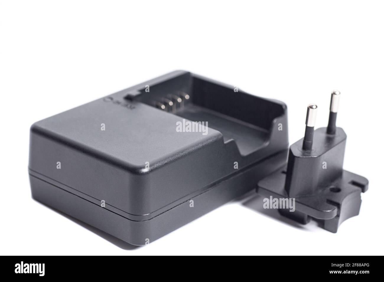 Charger for digital cameras isolated on white background Stock Photo ...