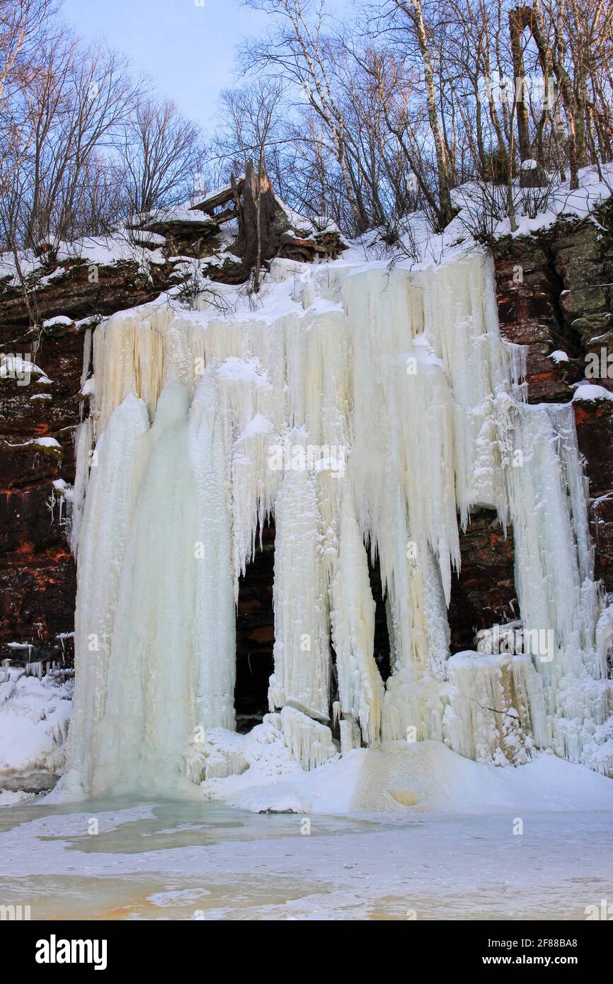 Frozen waterfalls and icicles on red cliffs on Apostle Islands ...