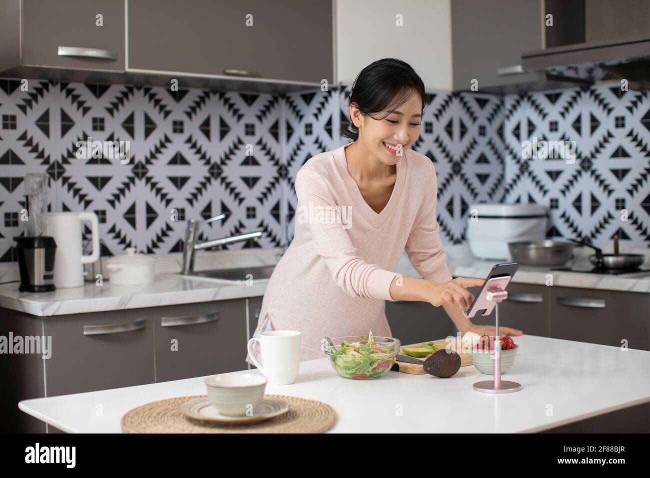 Woman touching phone counter hi-res stock photography and images - Alamy