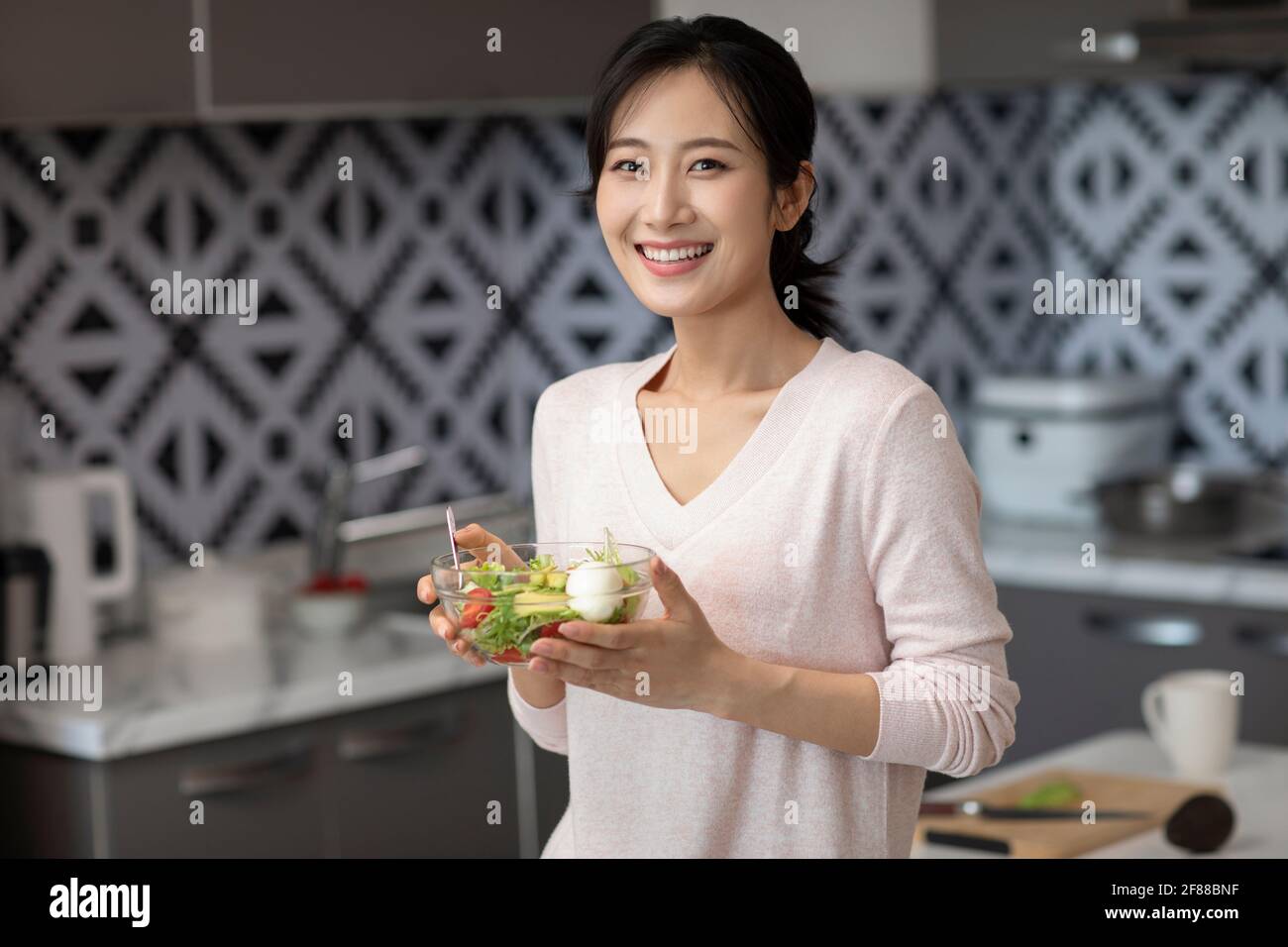 Woman cooking at home in china hi-res stock photography and images - Alamy