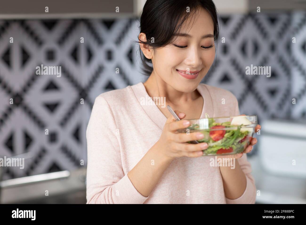 Woman cooking at home in china hi-res stock photography and images - Alamy