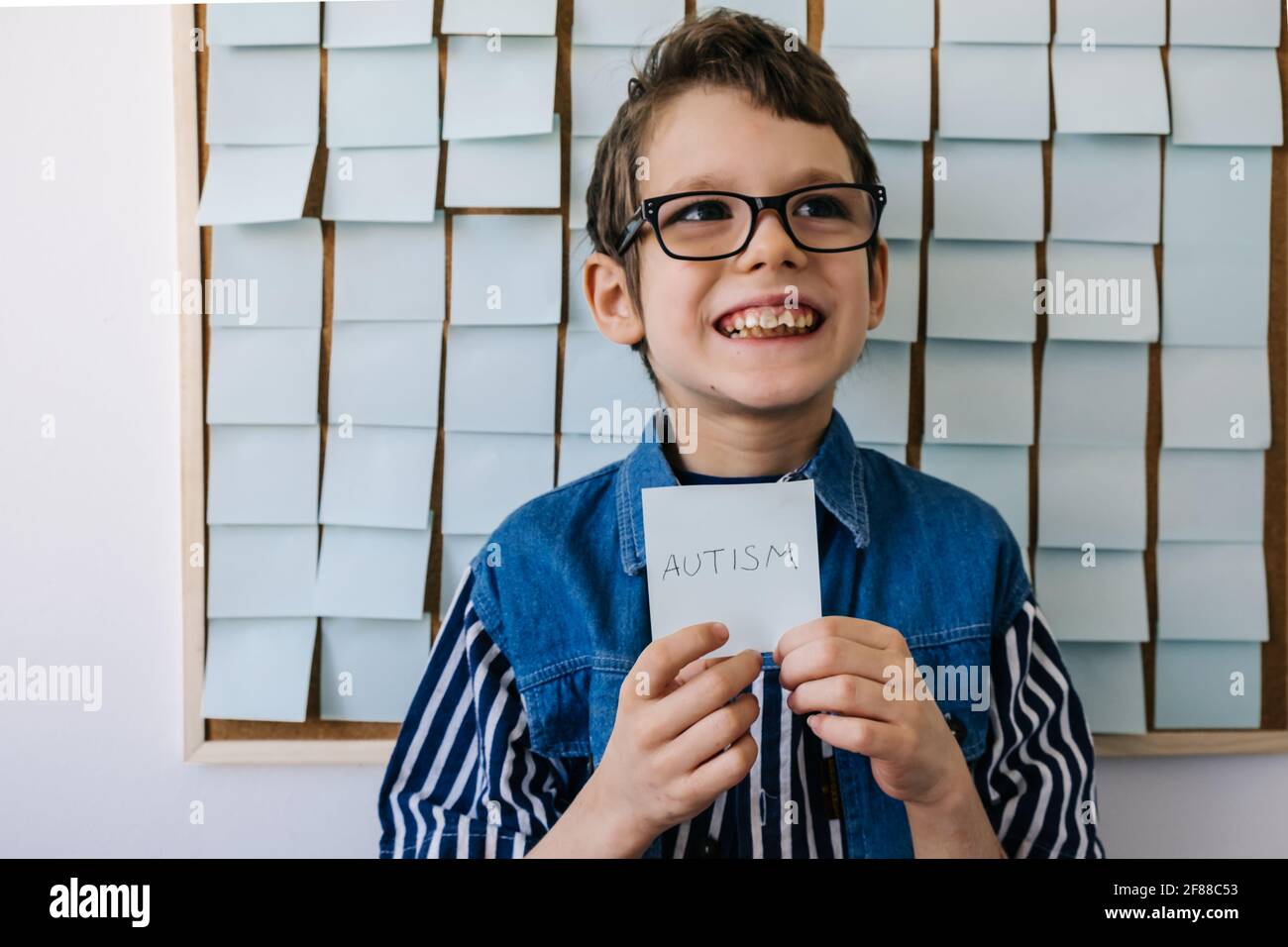 Autism child concept. Portrait of cheerful autism boy with glasses ...