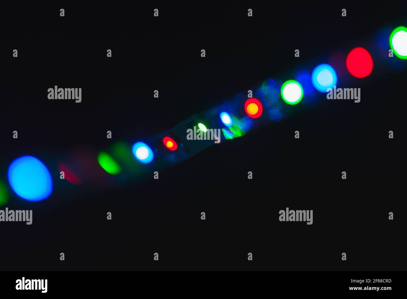 LED strip lights glowing in the dark, closeup photo with selective soft ...