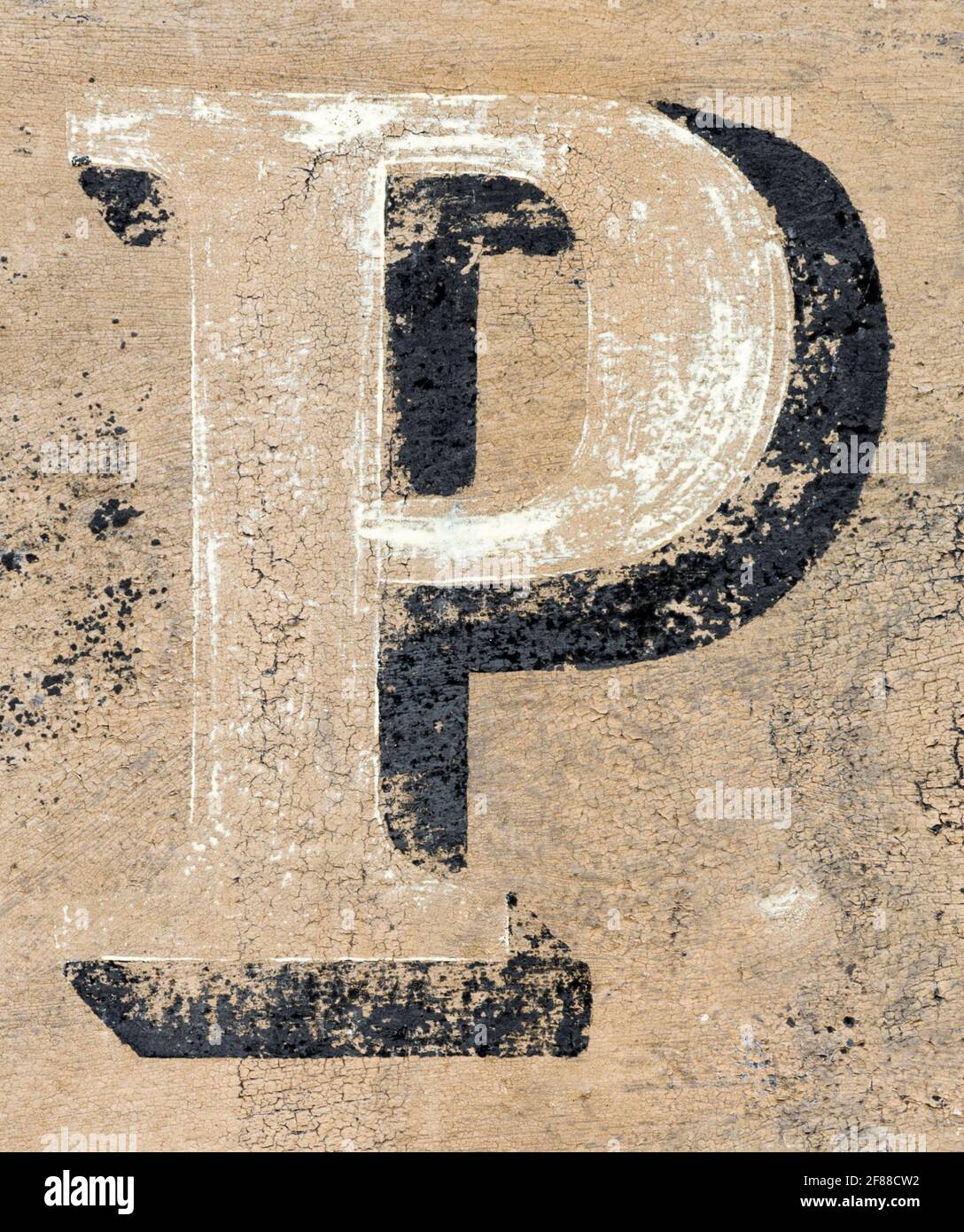 Dissolving letter P of a historical advertising font Stock Photo - Alamy