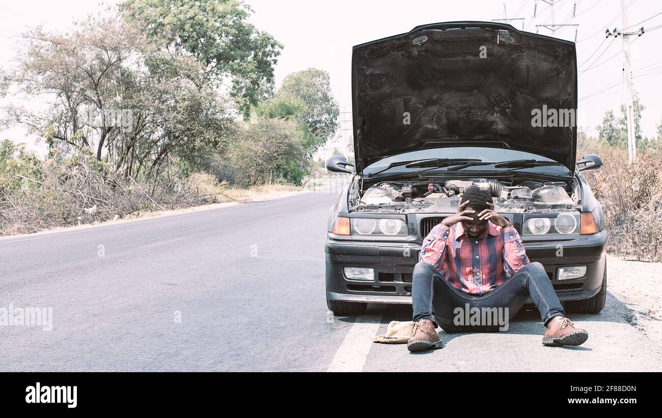Worried man with broken down car hi-res stock photography and images ...