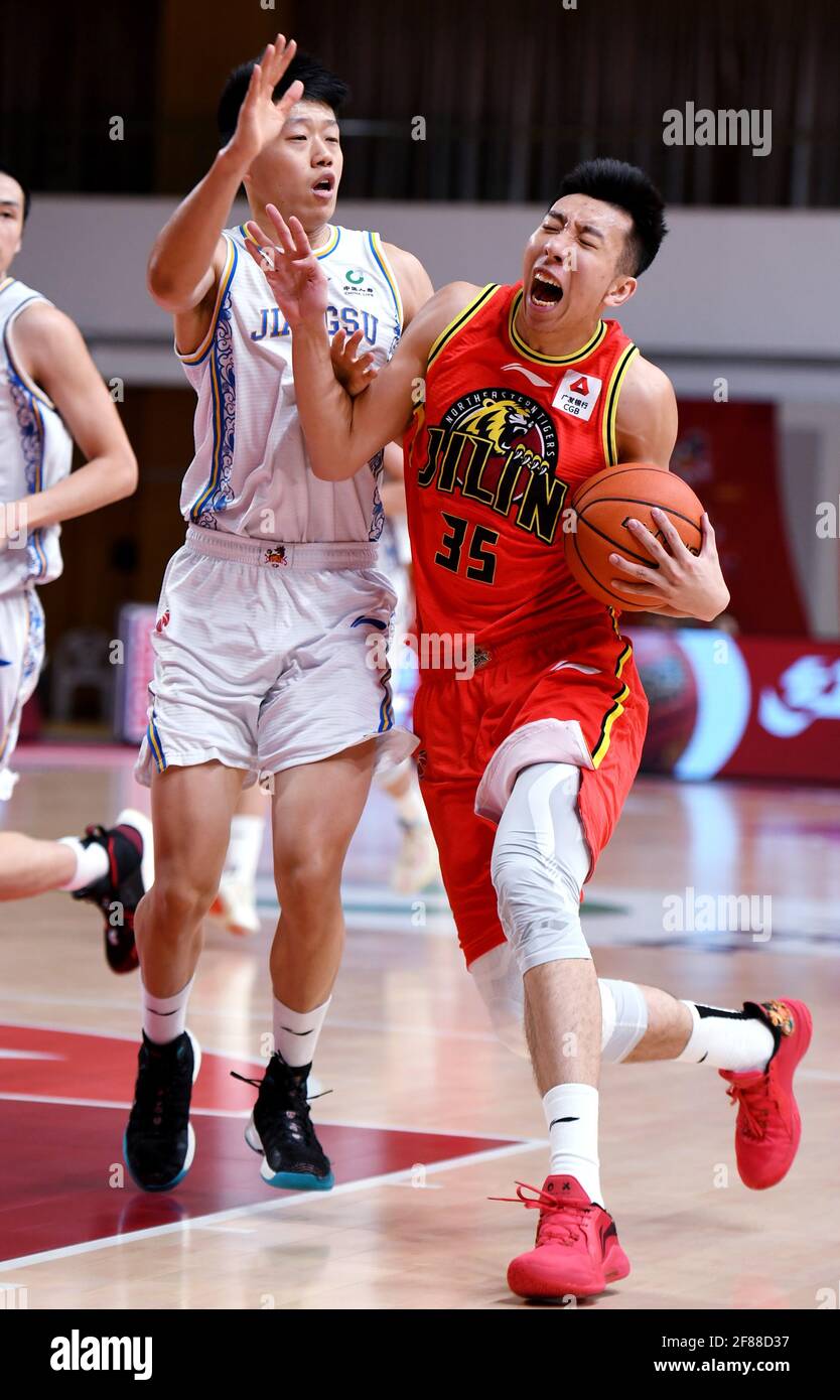 Zhuji, China's Zhejiang Province. 12th Apr, 2021. Ding Haoran (R) of Jilin Northeast Tigers ...