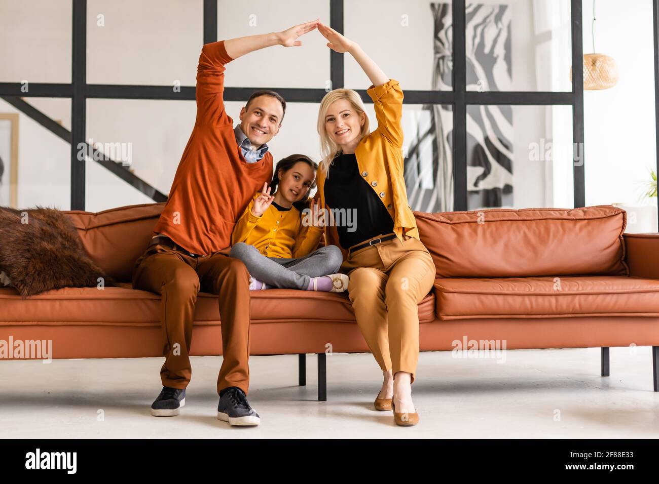 family in house planning with daughter Stock Photo - Alamy