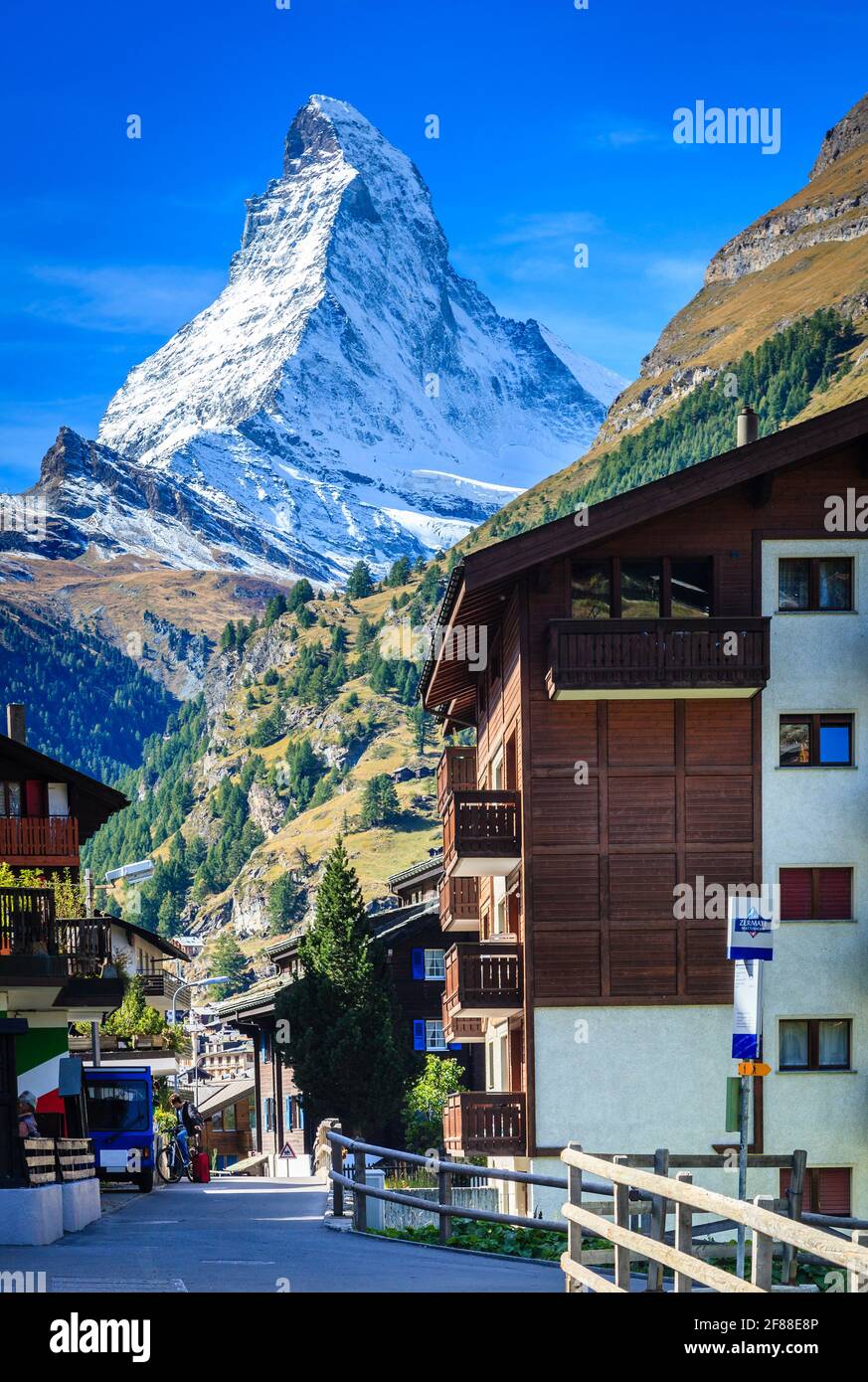A street in the Swiss resort town of Zermat with a view of Matterhorn ...