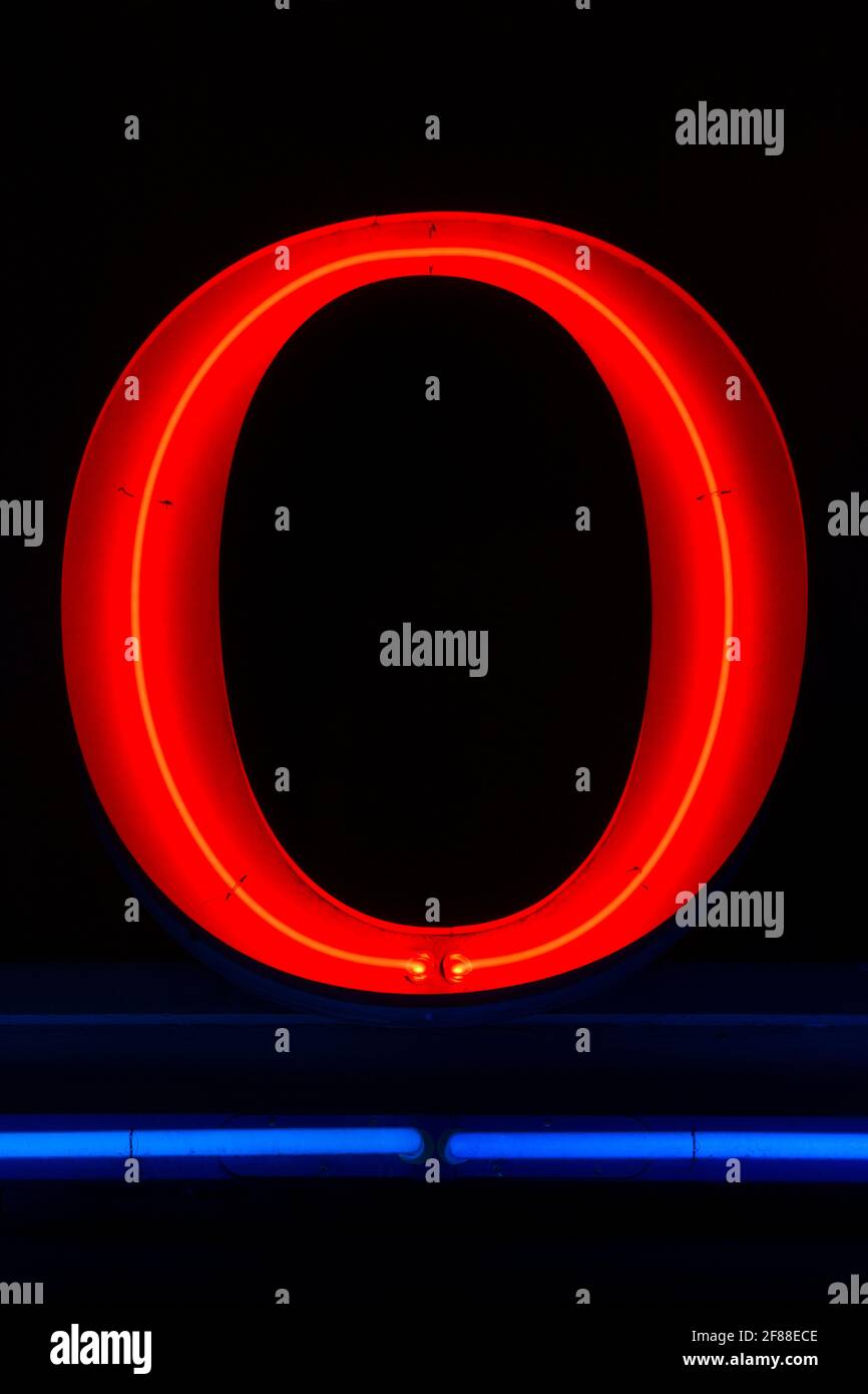 Red glowing neon letter O at night with blue underline Stock Photo - Alamy