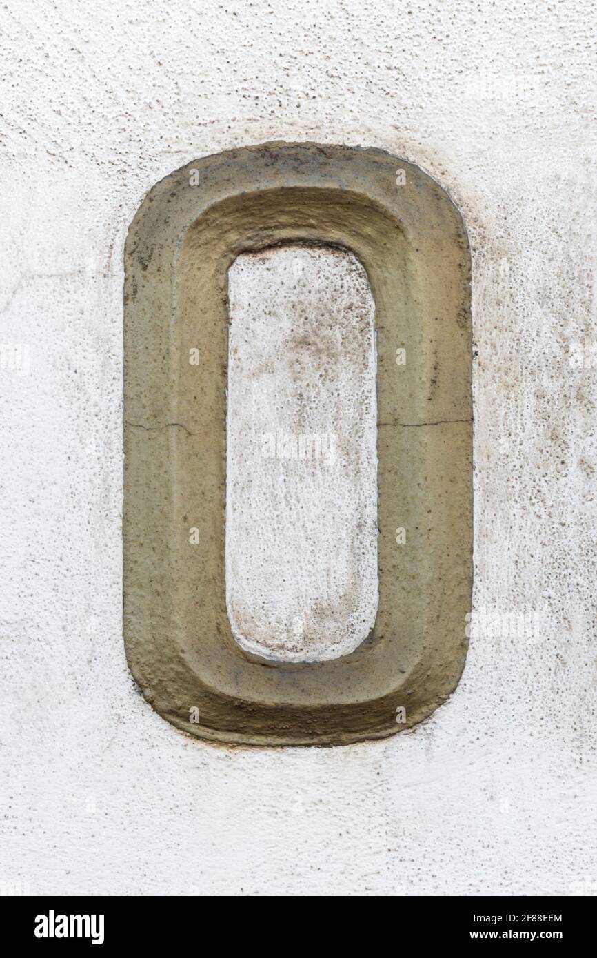 Olive green stucco capital letter O Stock Photo - Alamy