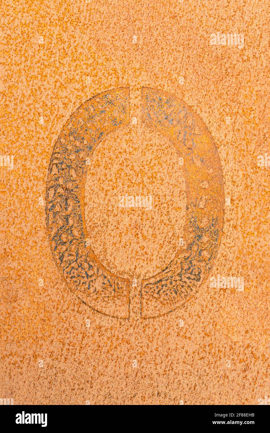 Remains of a letter O on a rusted metal plate Stock Photo - Alamy
