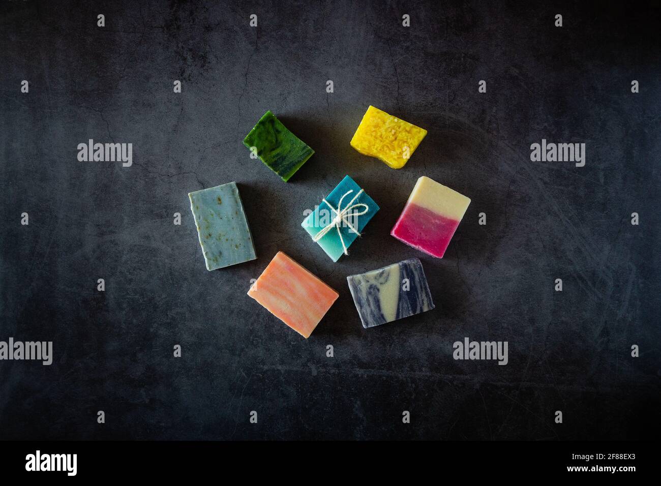Flat lay of natural handmade soaps. Top view. Dark background Stock ...