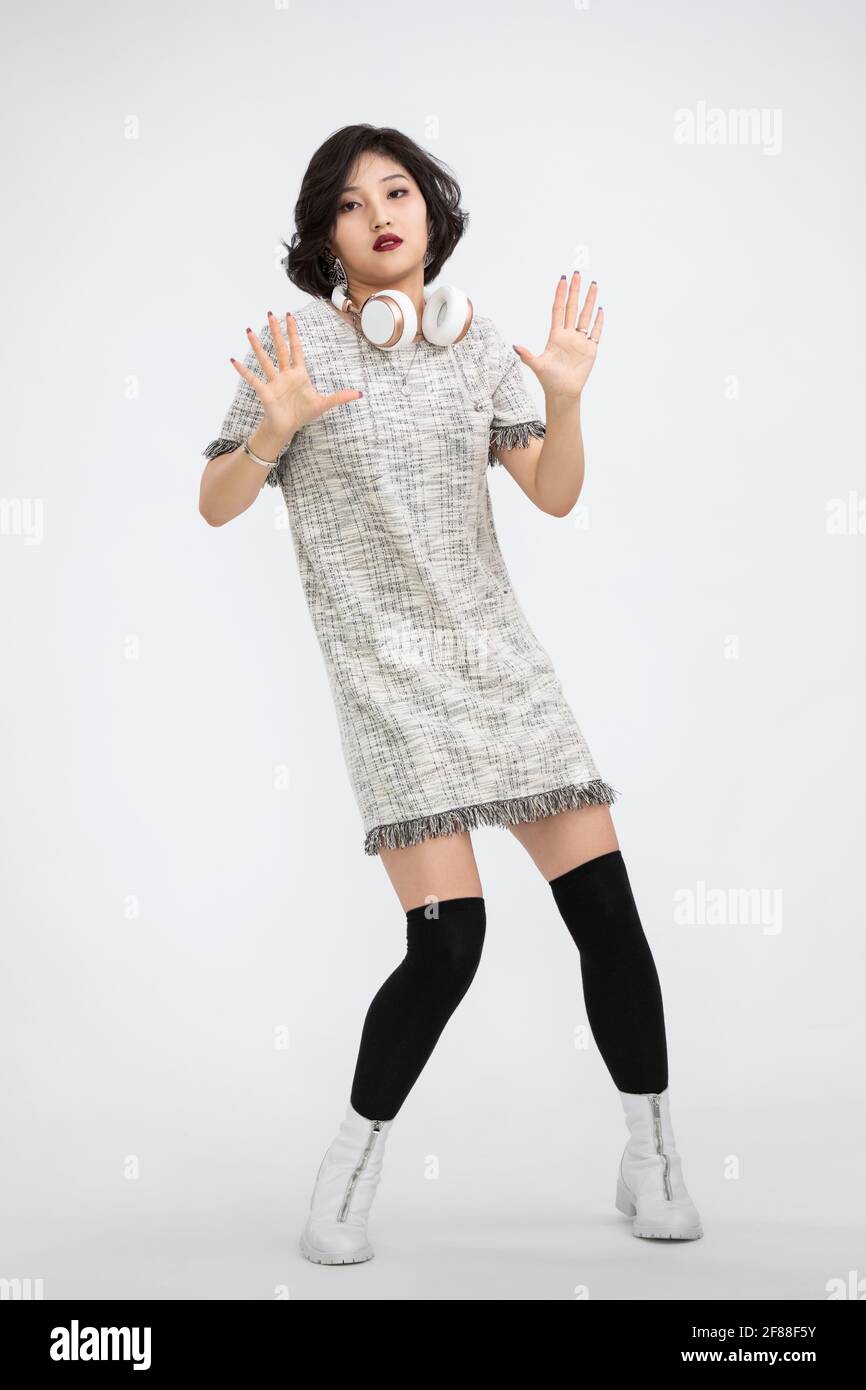 Cool young woman dancing Stock Photo - Alamy