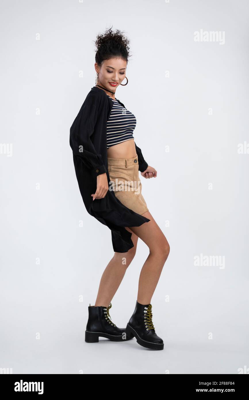 Cool young woman dancing Stock Photo - Alamy