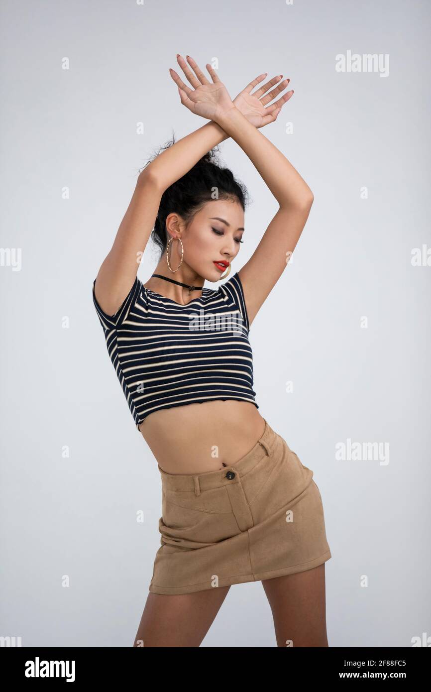 Cool young woman dancing Stock Photo - Alamy