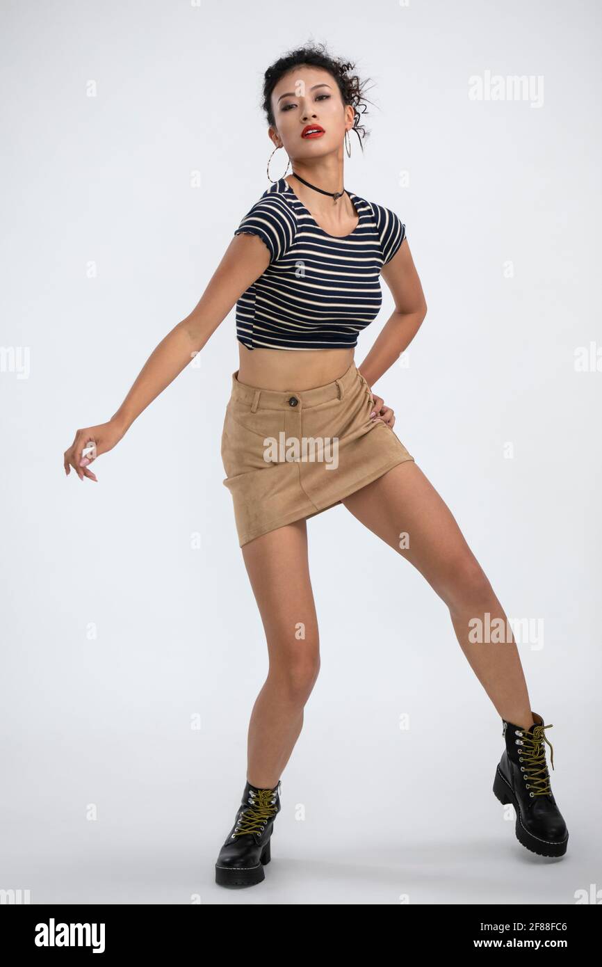 Cool young woman dancing Stock Photo - Alamy