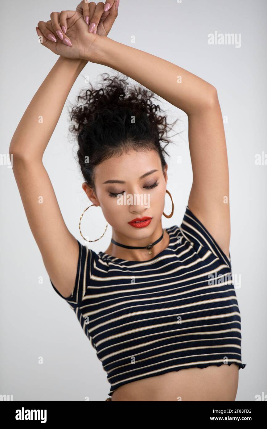 Cool young woman dancing Stock Photo - Alamy