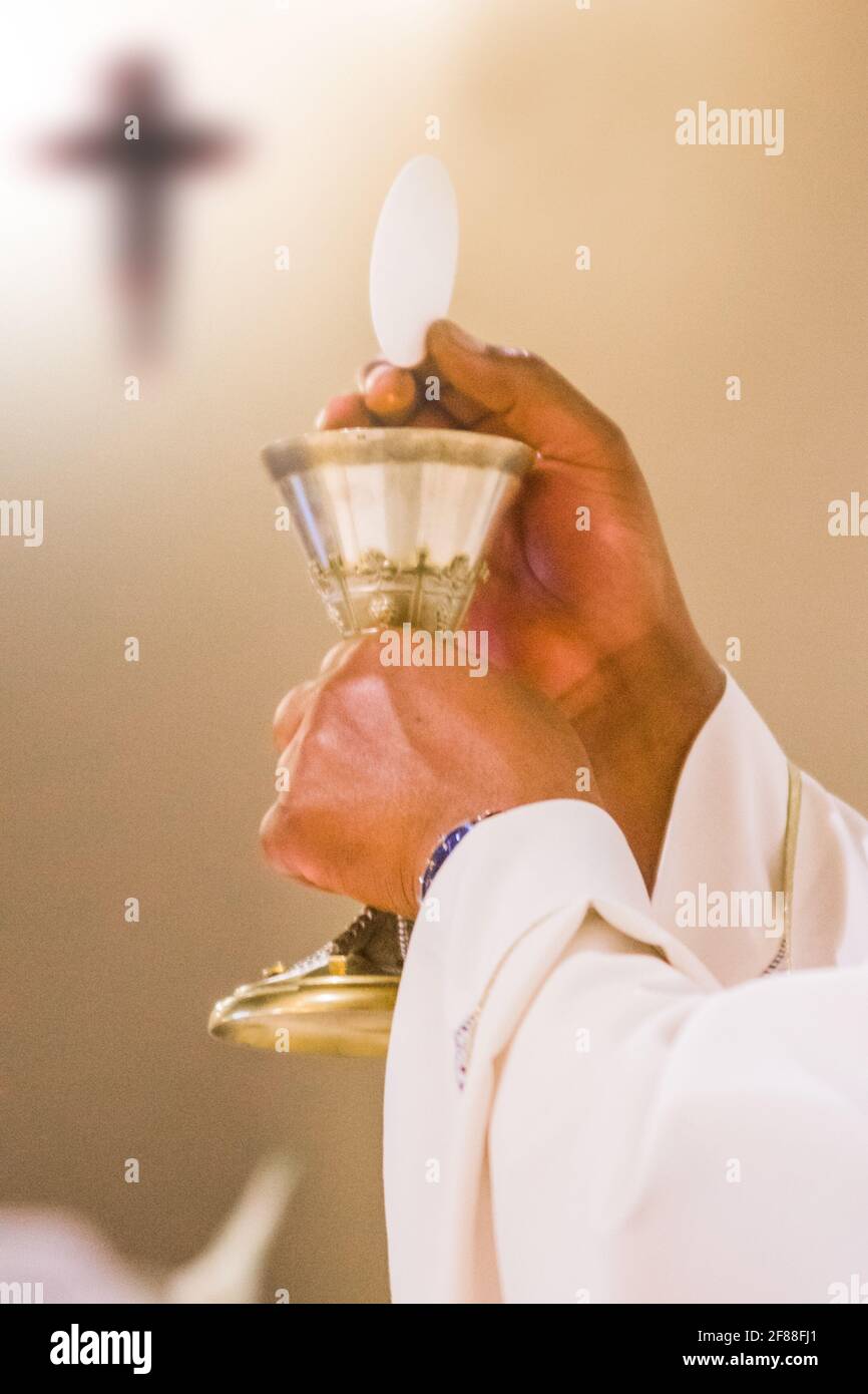 bread becomes the body of Christ in the hands of the pope, holy father ...