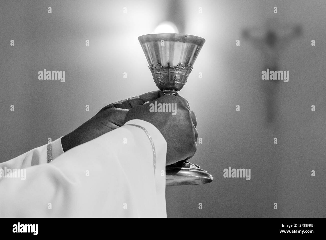 bread becomes the body of Christ in the hands of the pope, holy father ...