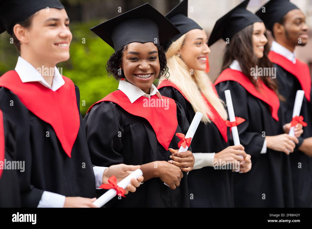 Happy black lady smiling at camera while having graduation ceremony ...