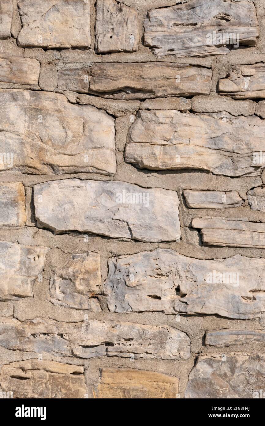 Wall made of natural stones Stock Photo - Alamy