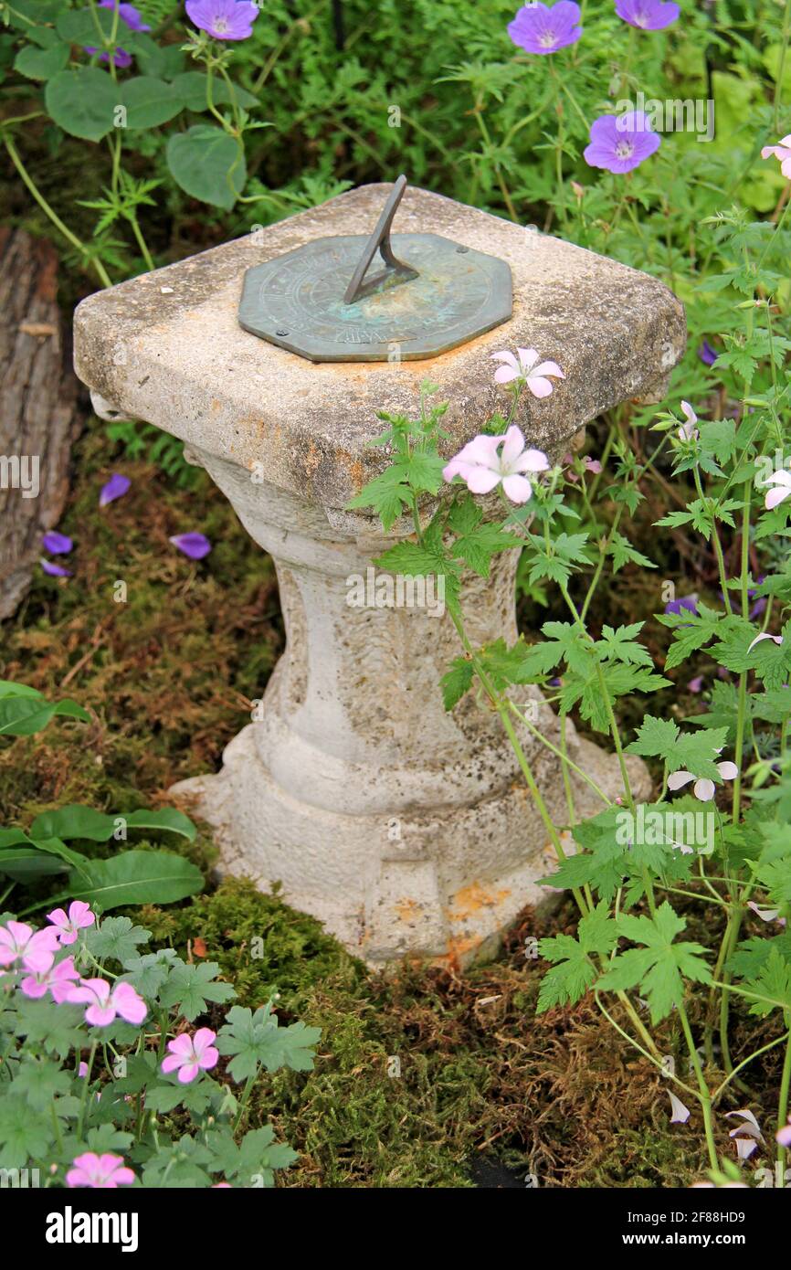 A Traditional Sundial in a Pretty Garden Setting Stock Photo - Alamy