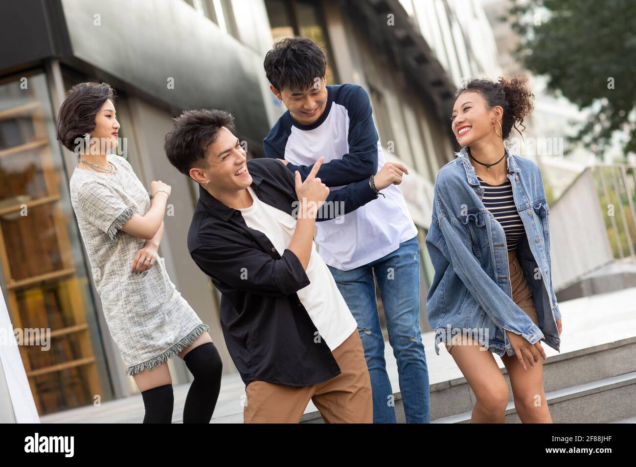 Four friends having fun dancing hi-res stock photography and images - Alamy