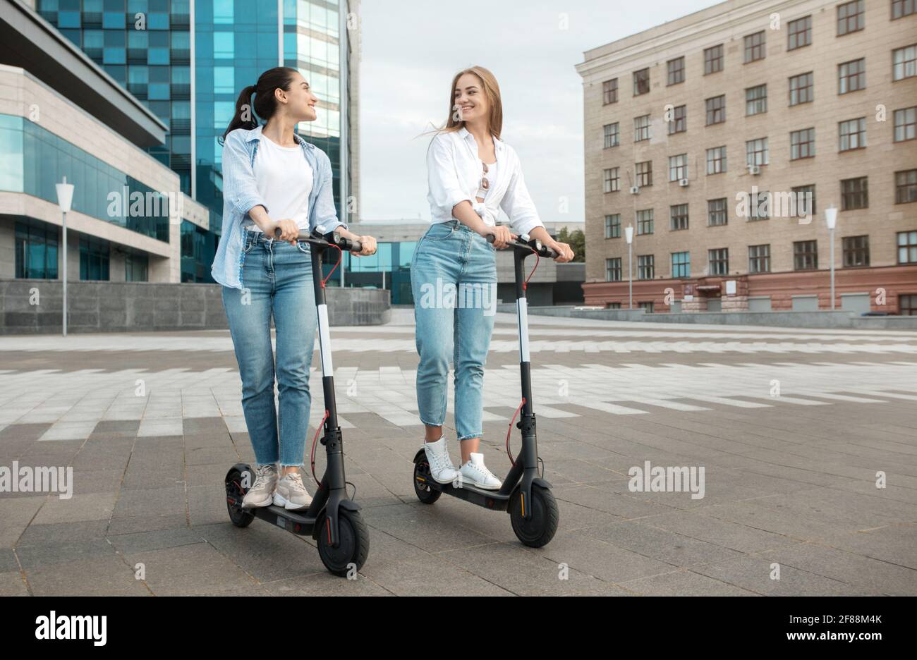 Riding motorized scooter hi-res stock photography and images - Alamy