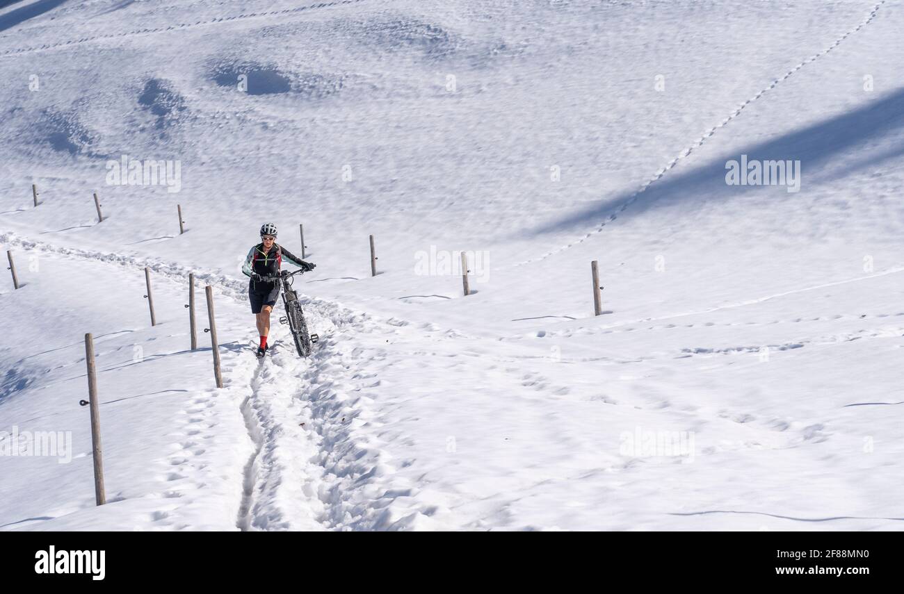 Female mountainbike snow hi-res stock photography and images - Alamy