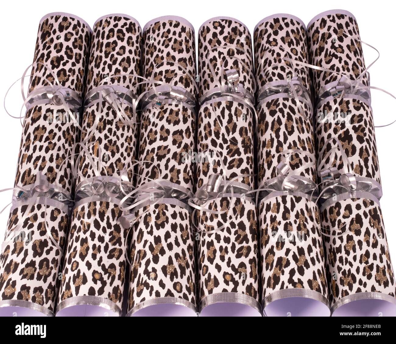 Studio shot of traditional Christmas Crackers with a snow leopard print ...