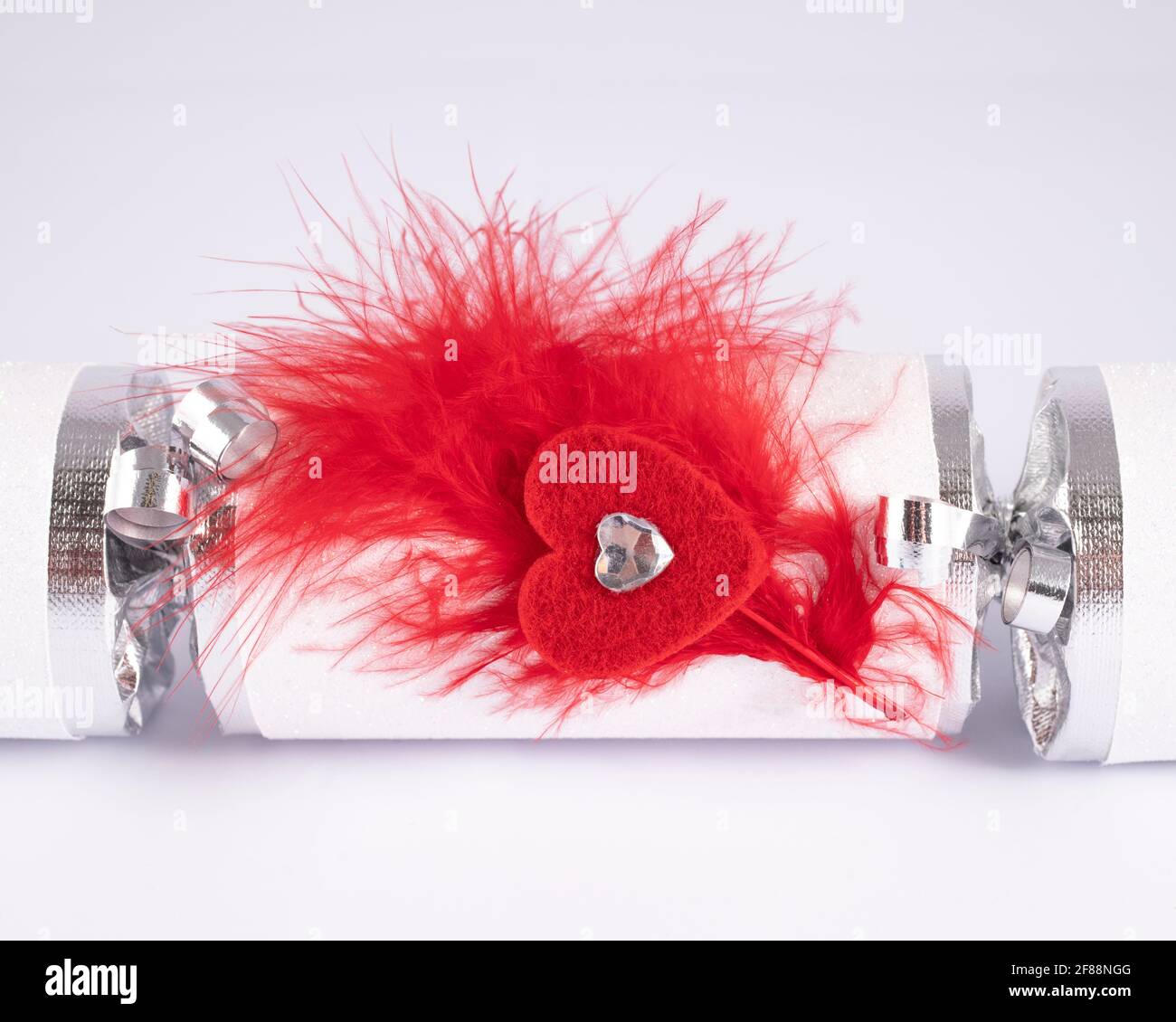Pulling christmas cracker close up hi-res stock photography and images ...