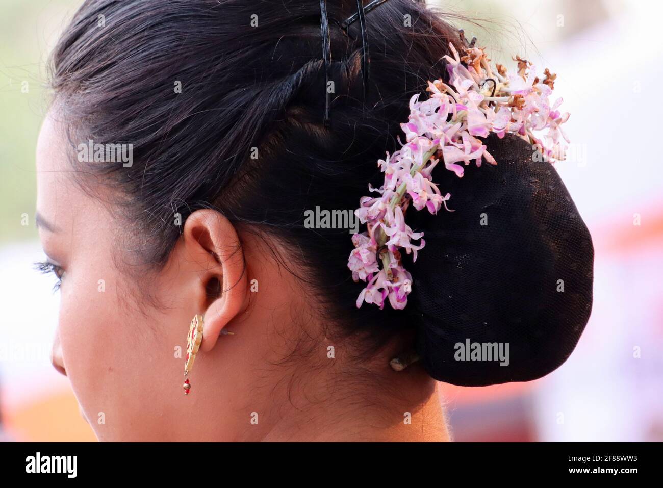 Guwahati, Assam, India. 12th Apr, 2021. A women wrap 'Kopou Phool ...