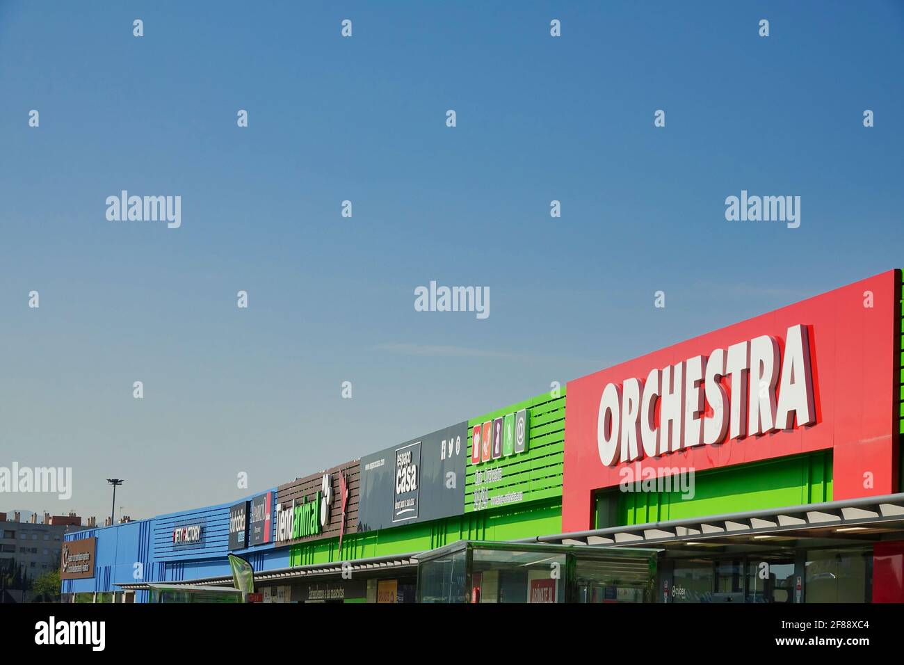 Colorful facades of different stores located in a Shopping Center in ...