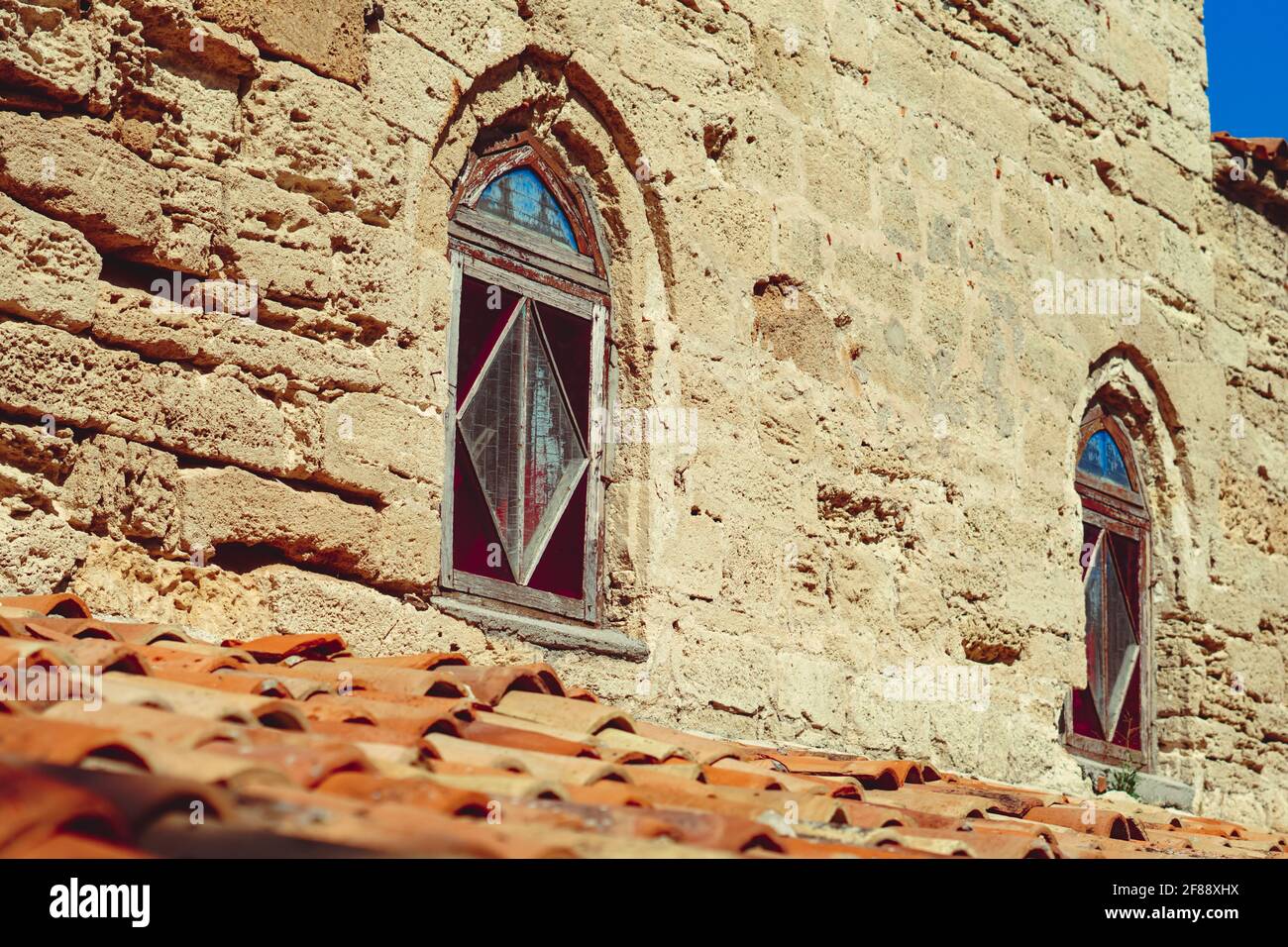 medieval building with old windows, old stone wall Stock Photo - Alamy