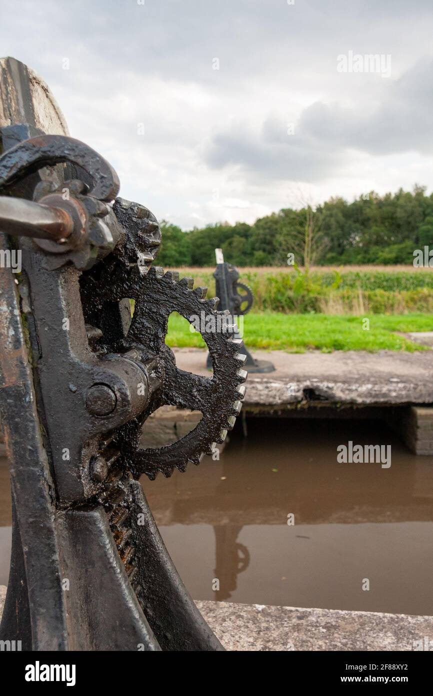 The heavily greased gears of a lock sluice are seen against the ...