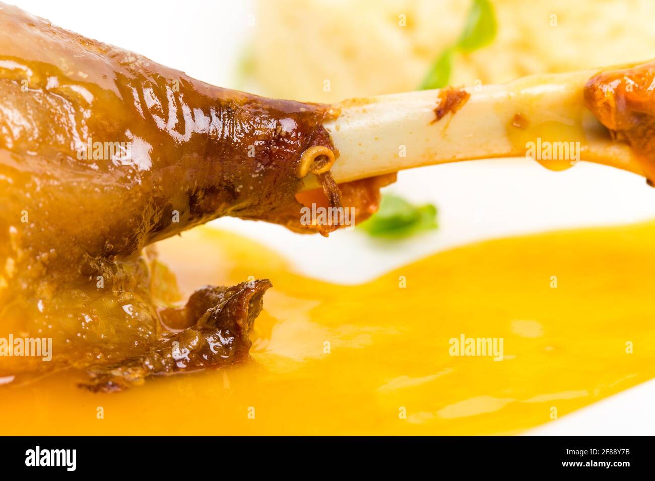 Duck leg confit with couscous and baked vegetables. Macro. Photo can be ...