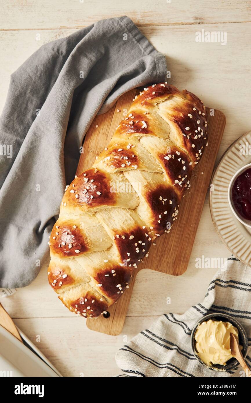 Vertical top view of delicious sweet yeast bread with sesame seeds ...