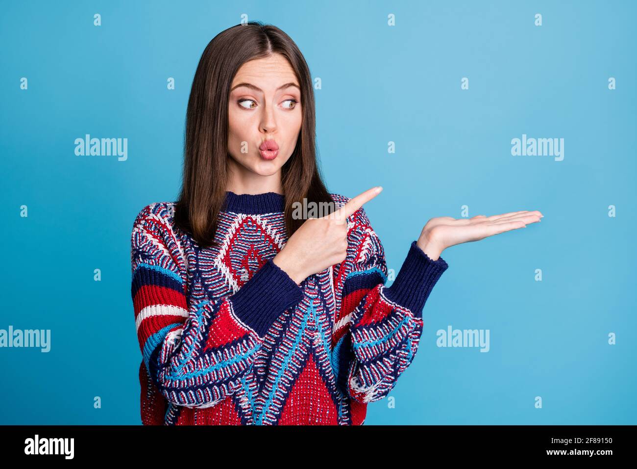 Photo portrait of pretty girl holding empty space on hand pointing ...
