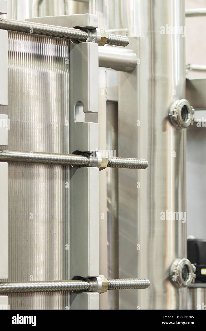 Plate heat exchanger assembly with threaded rods Stock Photo - Alamy