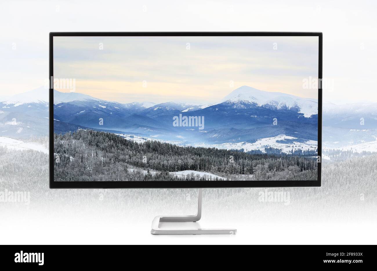 Beautiful landscape with snowy mountains on screen of modern TV set ...