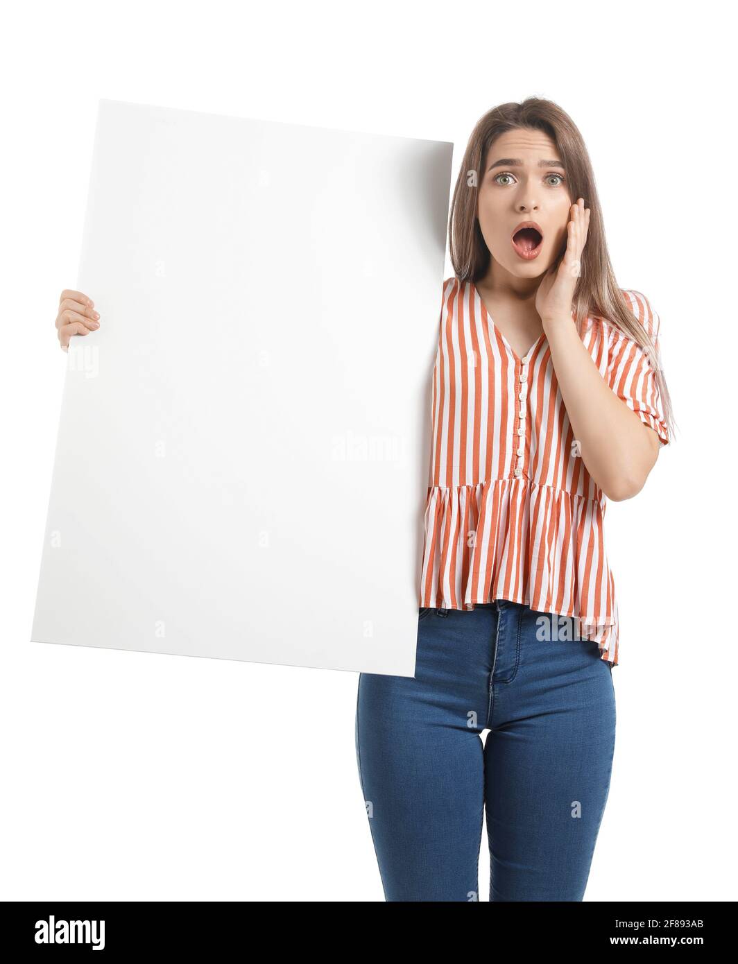 Surprised young woman with blank poster on white background Stock Photo ...