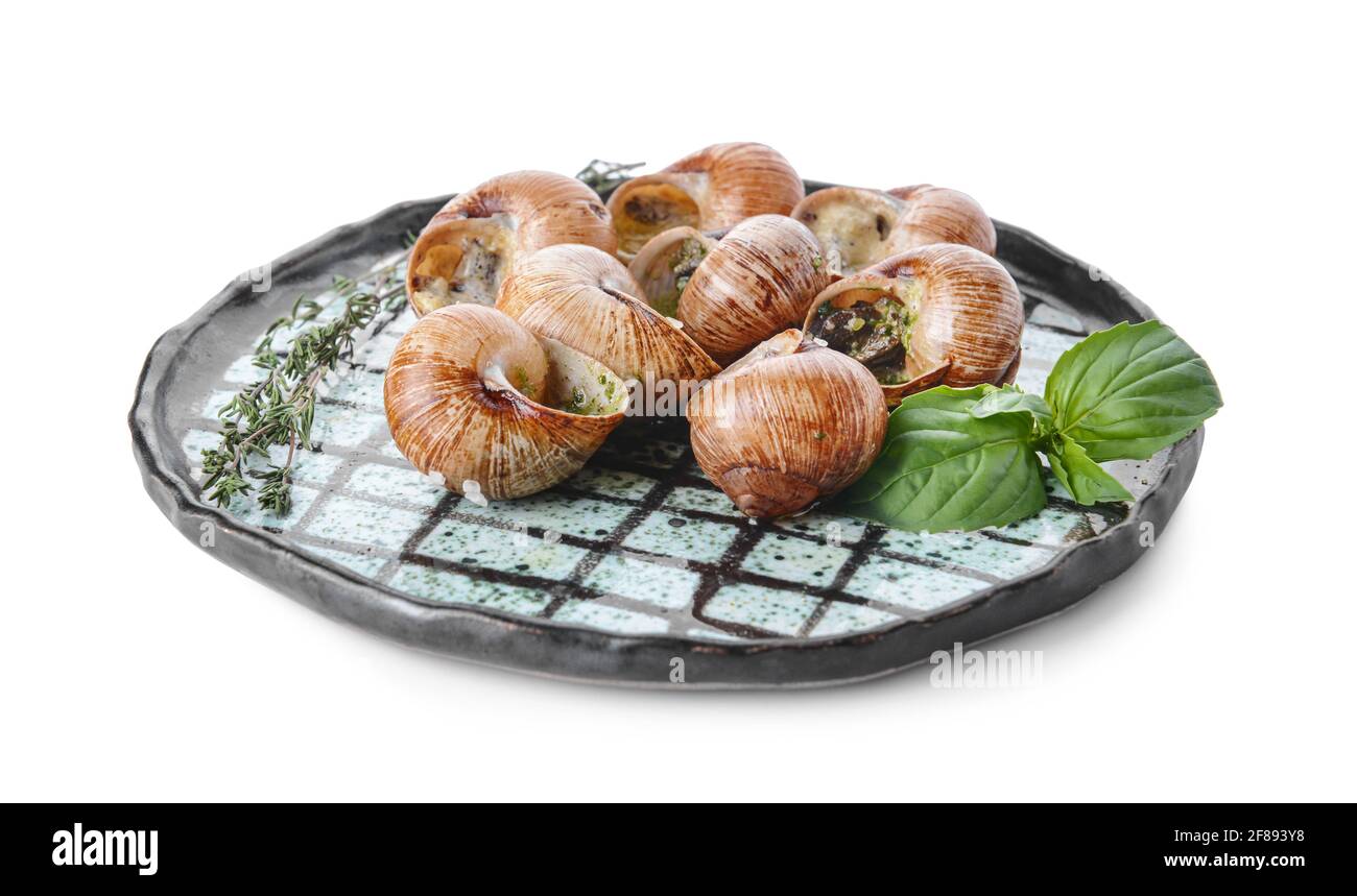 Plate with tasty snails on white background Stock Photo - Alamy