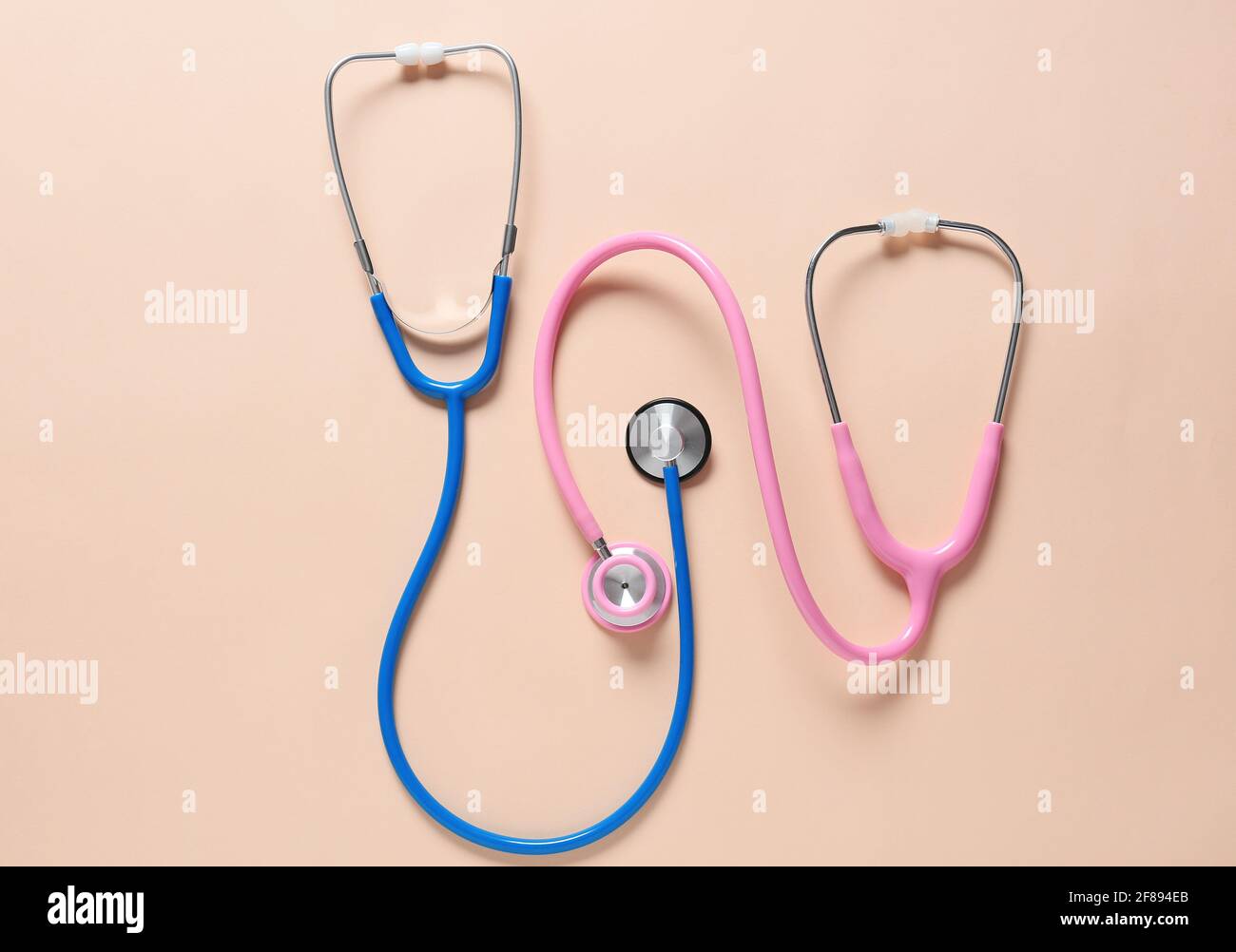 Modern stethoscopes on color background Stock Photo - Alamy