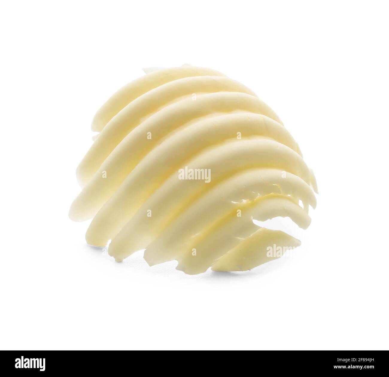 Curl of butter on white background Stock Photo - Alamy
