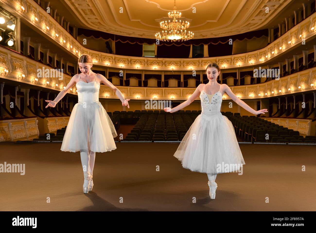 Beautiful young ballerinas dancing in theatre Stock Photo - Alamy