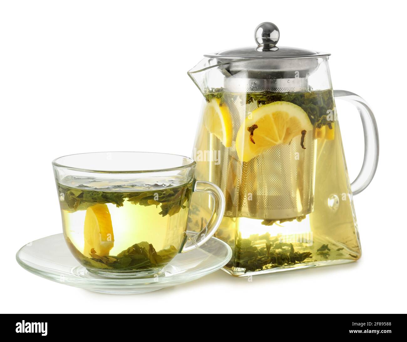 Cup and teapot of green tea with lemon on white background Stock Photo ...