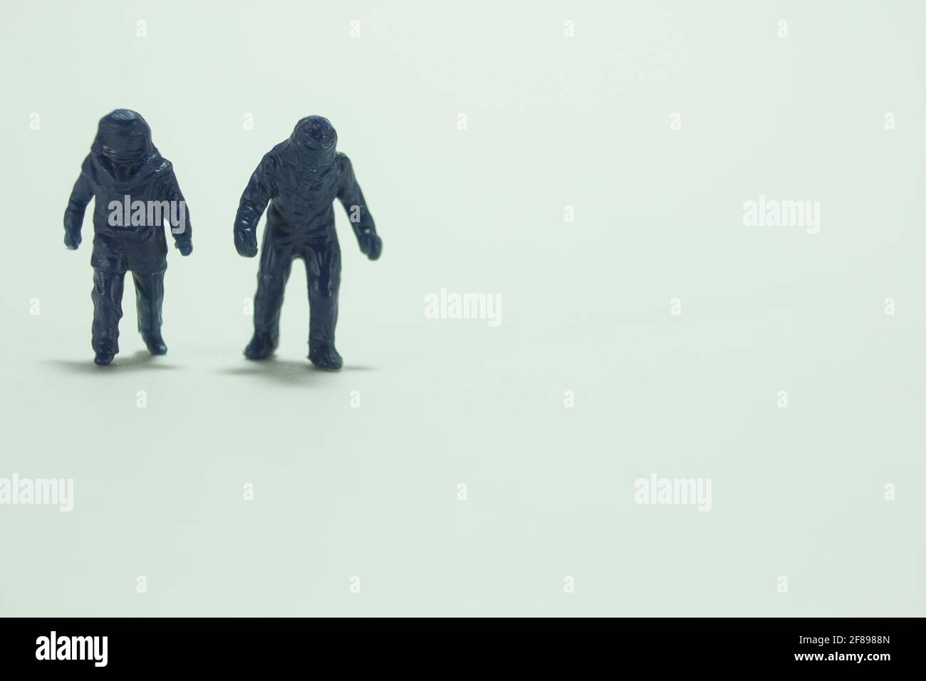 Minifigures of two walking people in bomb suits /miniature people Stock ...