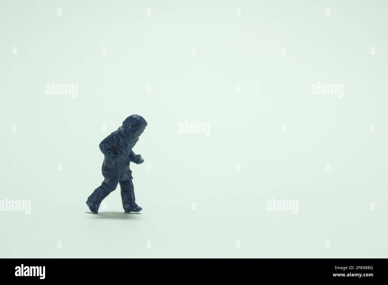 Minifigure of a running person in bomb suit/miniature people Stock ...